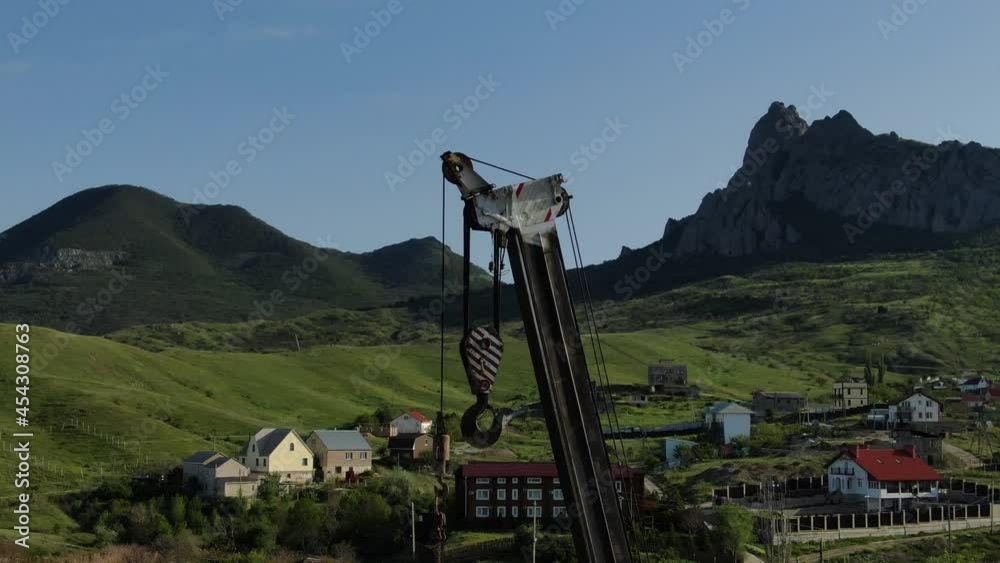 Main boom head of building mobile crane at the background of rural ...