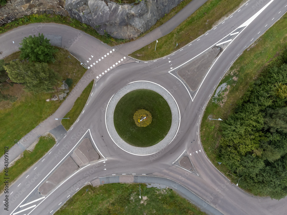 Bird's eye view of a traffic roundabout, roads, lanes with no cars and ...