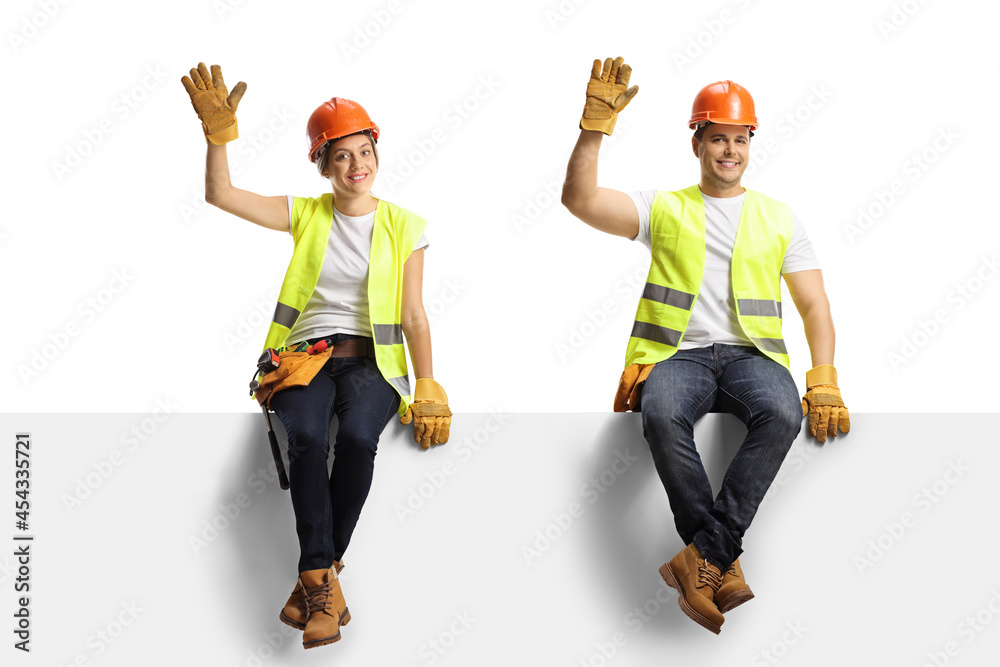 Male and female construction workers sitting on a panel and waving ...