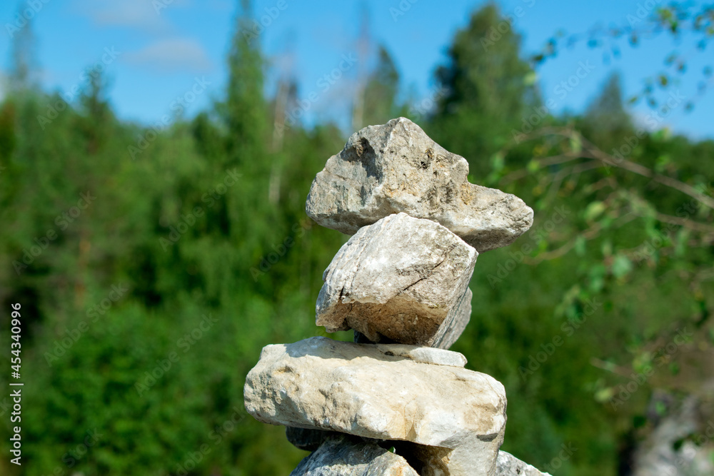 Stone cairn in Ruskeala park, Karelia, on a sunny day. Stack of stones ...