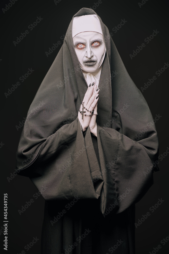 praying possessed nun Stock Photo | Adobe Stock