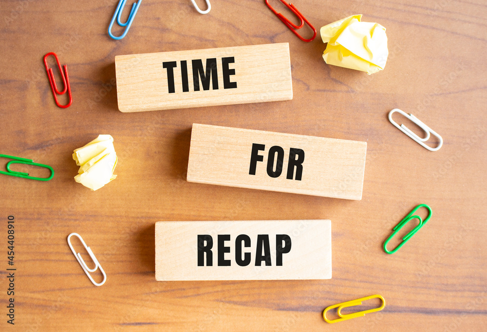 Wooden blocks are scattered on the table. TIME FOR RECAP is written on ...