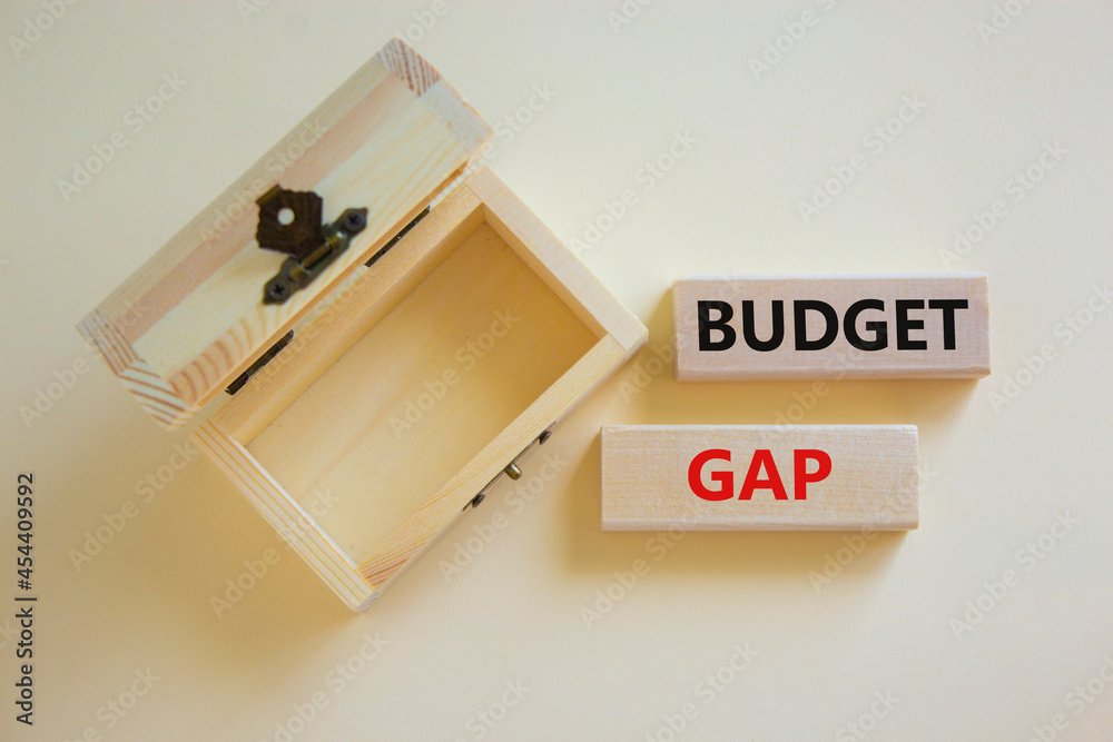 Budget gap symbol. Concept words 'budget gap' on wooden blocks on a ...