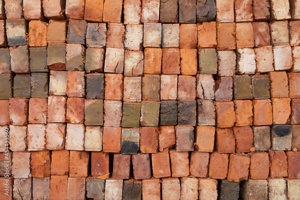 Texture of rows and columns of fired bricks, made by hand in a supply ...