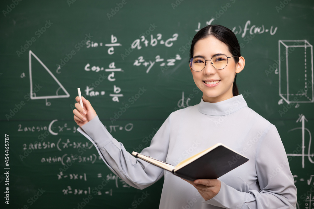 Young asian teacher woman teaching holding book and chalk video ...
