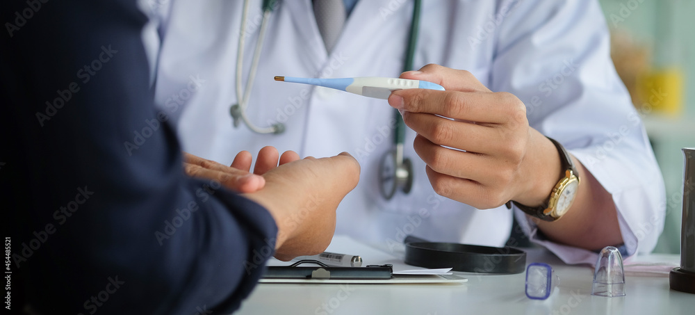 Doctor explaining health issues to a male patient. Stock Photo | Adobe ...
