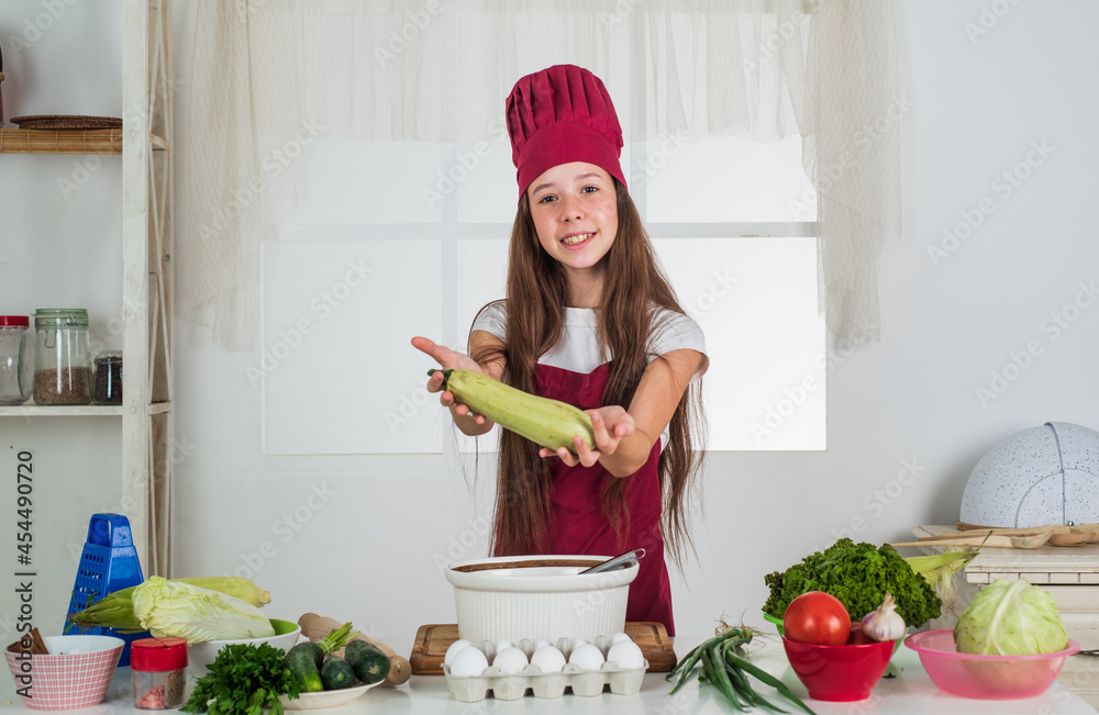 kid cooking food in kitchen. choosing a career. little helper with ...