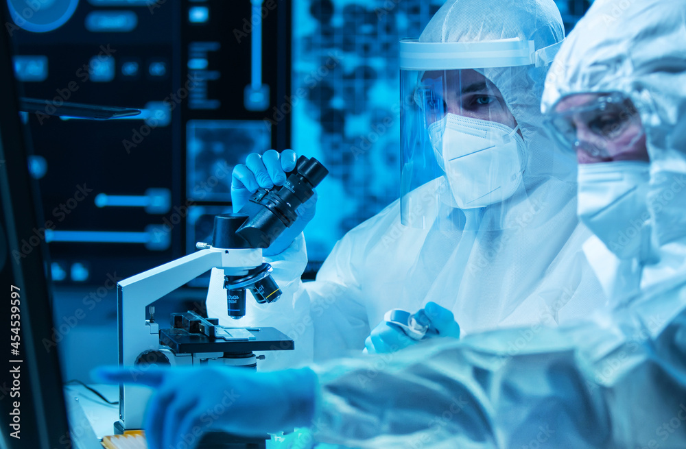 Scientists work in a modern scientific lab using laboratory equipment ...