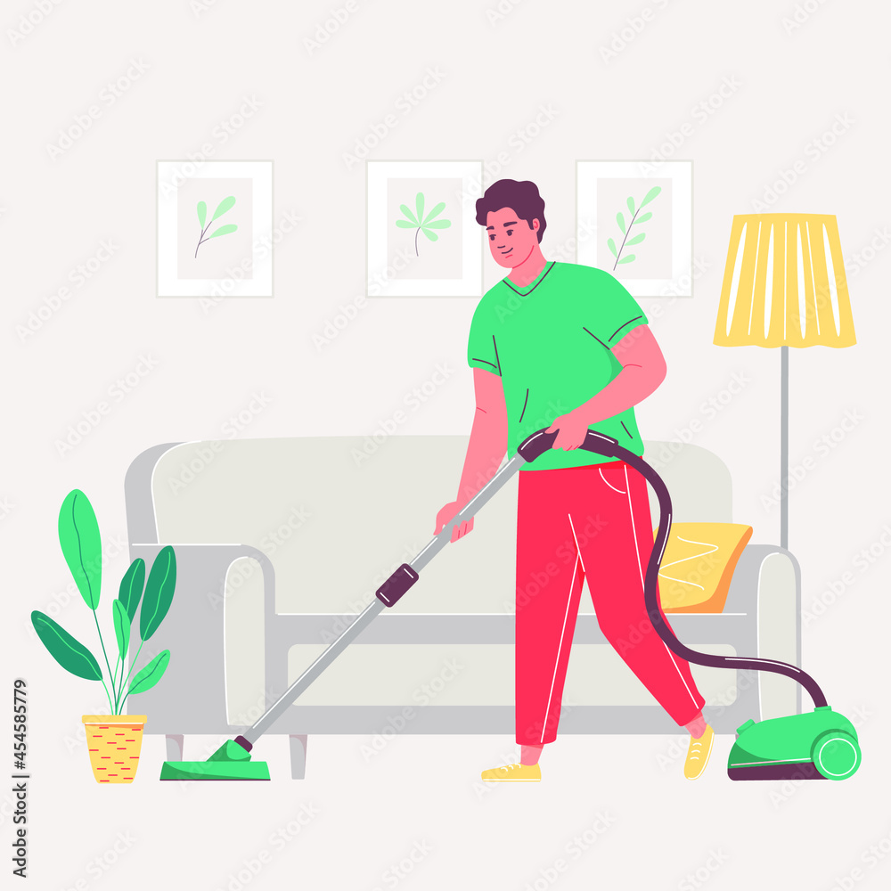 Young man engaged cleaning house. Boy vacuums house. Husband busy with ...