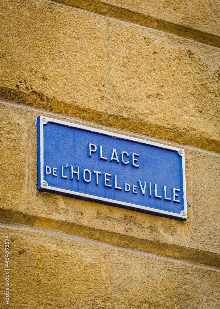 "Place de l'Hotel de Ville" street sign on the wall of the City Hall ...