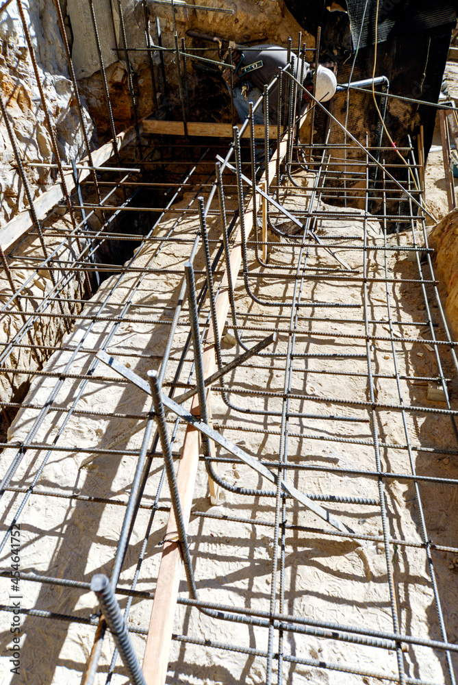 Photo & Art Print Concrete Mason installing rebar on a new structural ...
