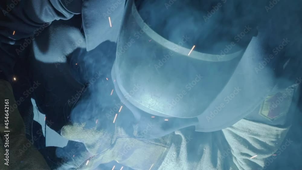 Welding Process of Metals. Operator is Holding a Welder Tool. Electrode ...