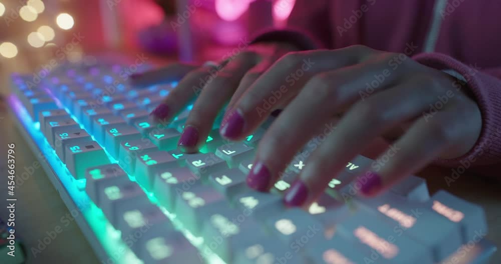teenage girl hands typing on keyboard gamer girl playing online game ...