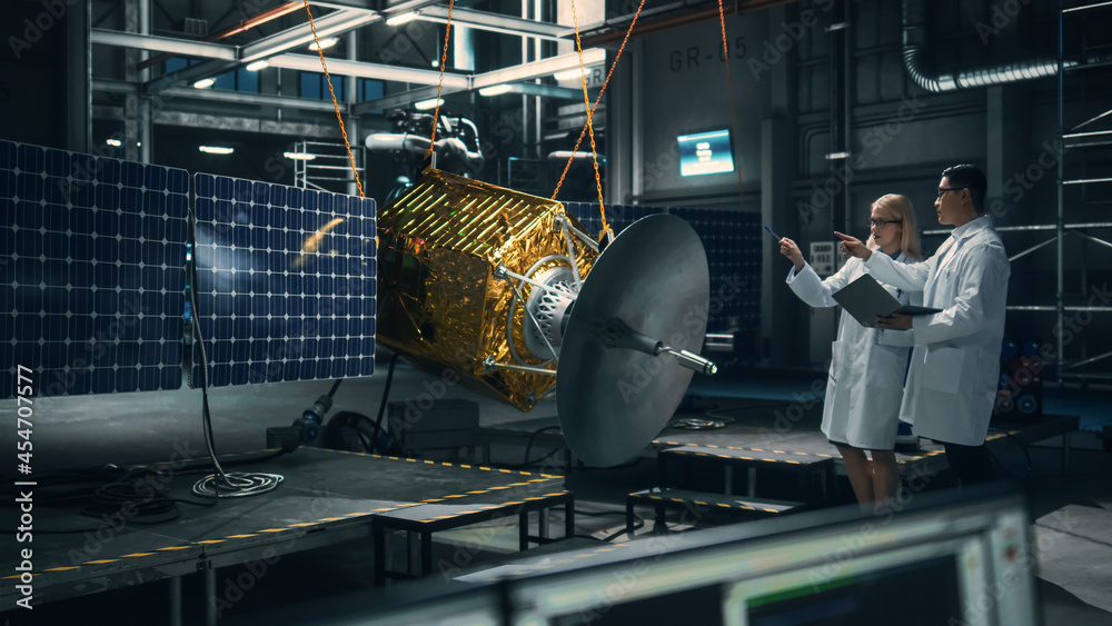 Engineer and Technician Working on Satellite Construction. Aerospace ...