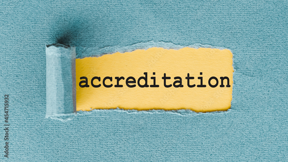 ACCREDITATION word written under torn paper. Stock Photo | Adobe Stock