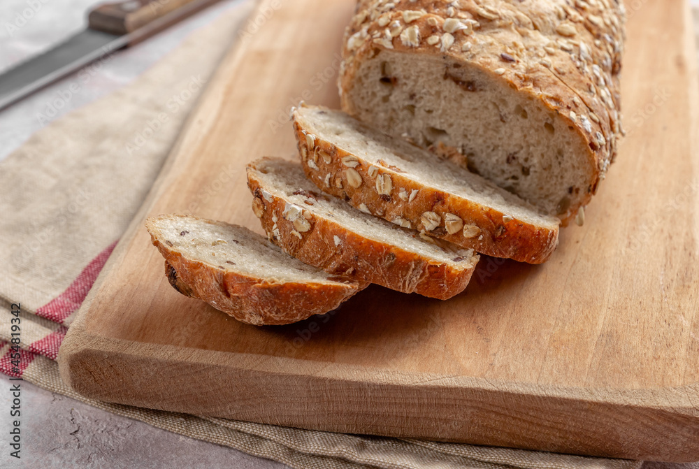 Rye bread loaf with seeds, raisins and muesli. Healthy food concept ...