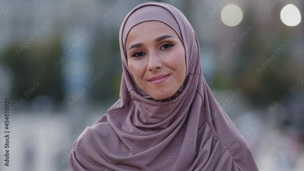 Close-up human female face portrait muslim girl young friendly smiling ...