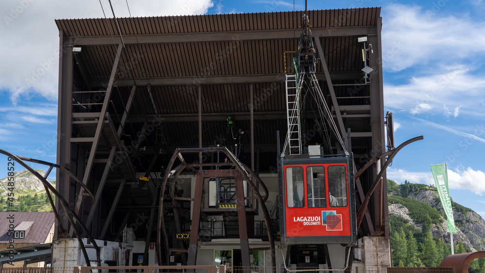 Passo Falzarego, Italy. The cable car at departure station. It connects ...