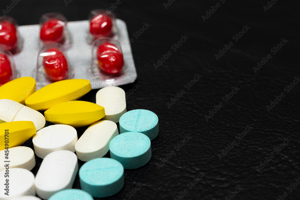 Pharmaceutical medicine pills in both tablets and capsules with the ...