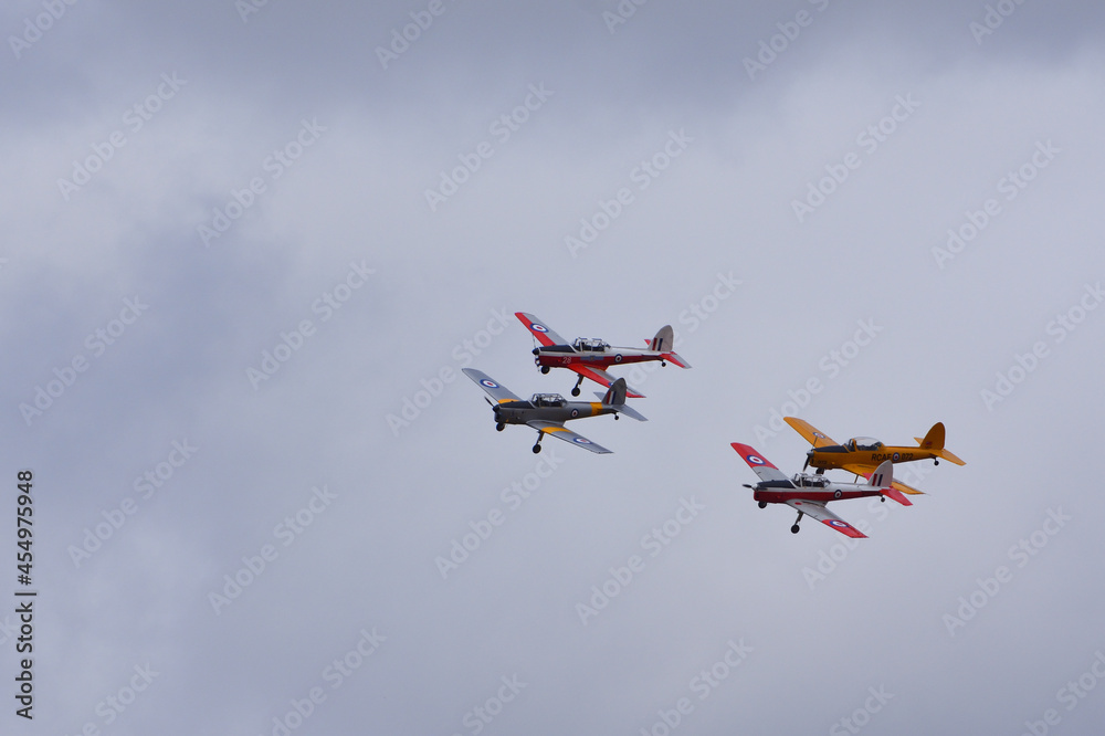 Four vintage de Havilland Chipmunk aircraft flying in formation. Stock ...