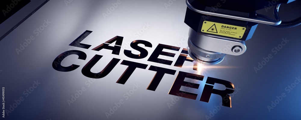 Laser cutter close up, cutting word "Laser cutter" into a metal sheet ...