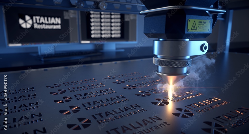 Laser cutter, cutting logo on a metal sheet. Stock Photo | Adobe Stock