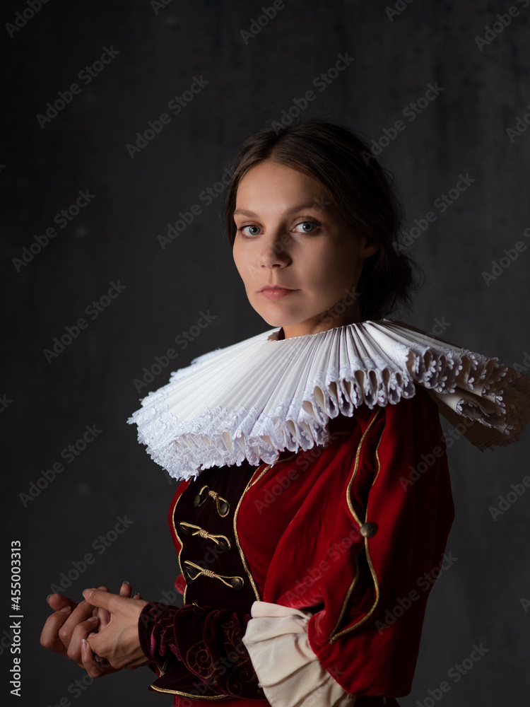 A noble lady in a luxurious red dress, medieval style, a young woman ...