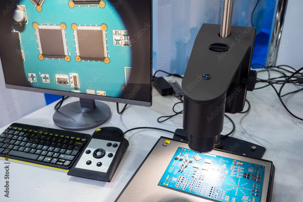 Chips on a microboard. Computer chips under an electron microscope ...