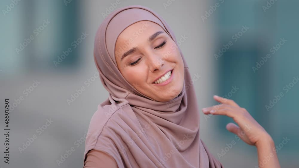 Portrait of beautiful young Arab muslim woman in traditional hijab ...