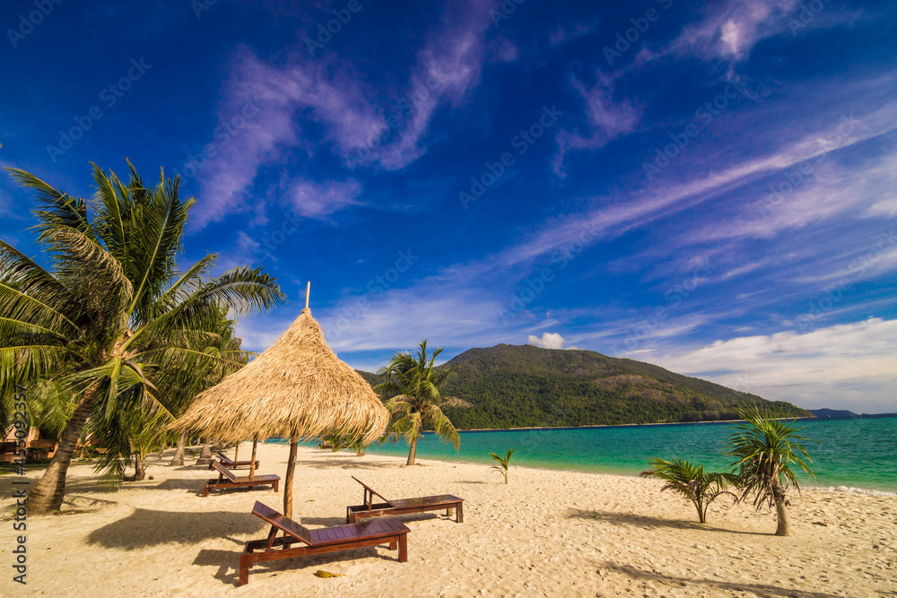 Wooden beach bench on white sand beach with coconut palm tree summer ...