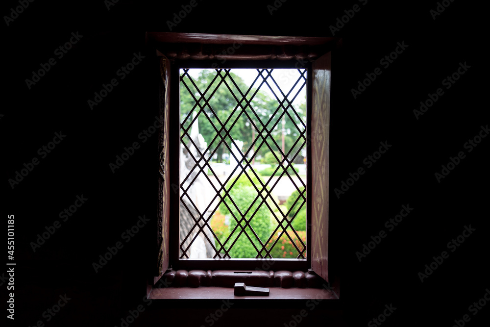Square window frame with metal line fence - looking though outside ...