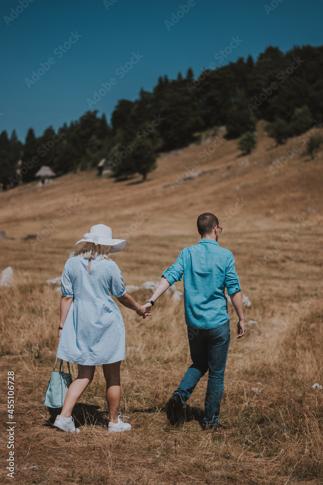 Couple Walking Away Hand In Hand
