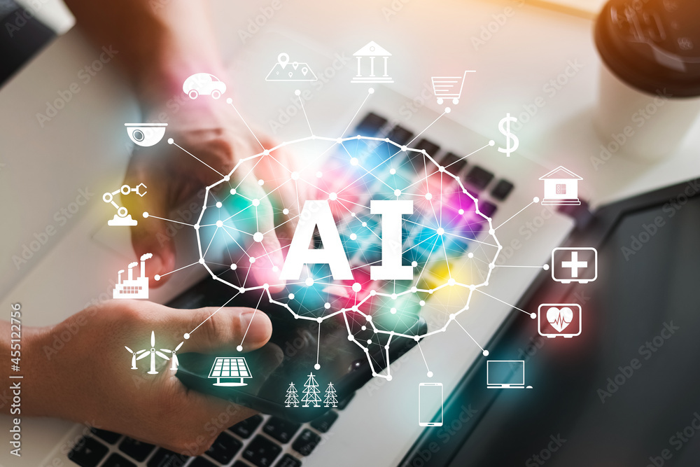 AI and IoT concepts of business, businessman working on a laptop ...