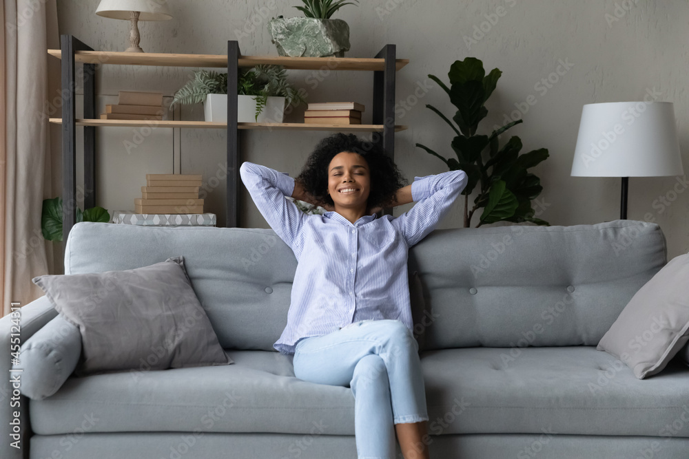 Carefree leisure. Tranquil teenage black female chill relax on comfy ...