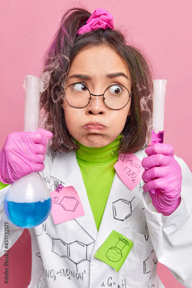 Woman Chemist In White Medical Coat Conducts Experiment For First Time