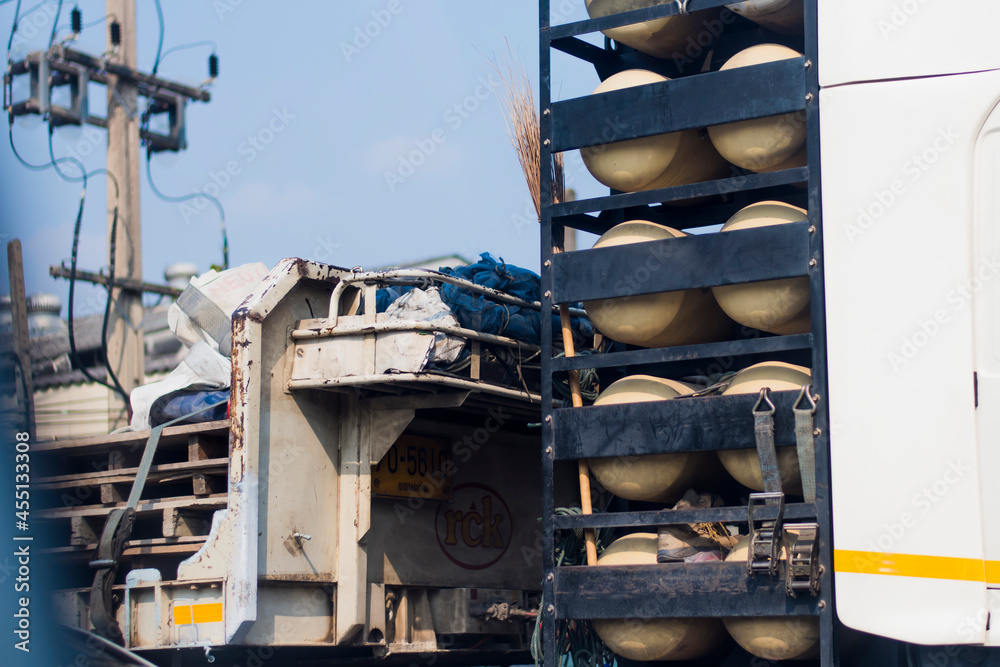 The head of a truck equipped with a gas tank behind the head of the car ...