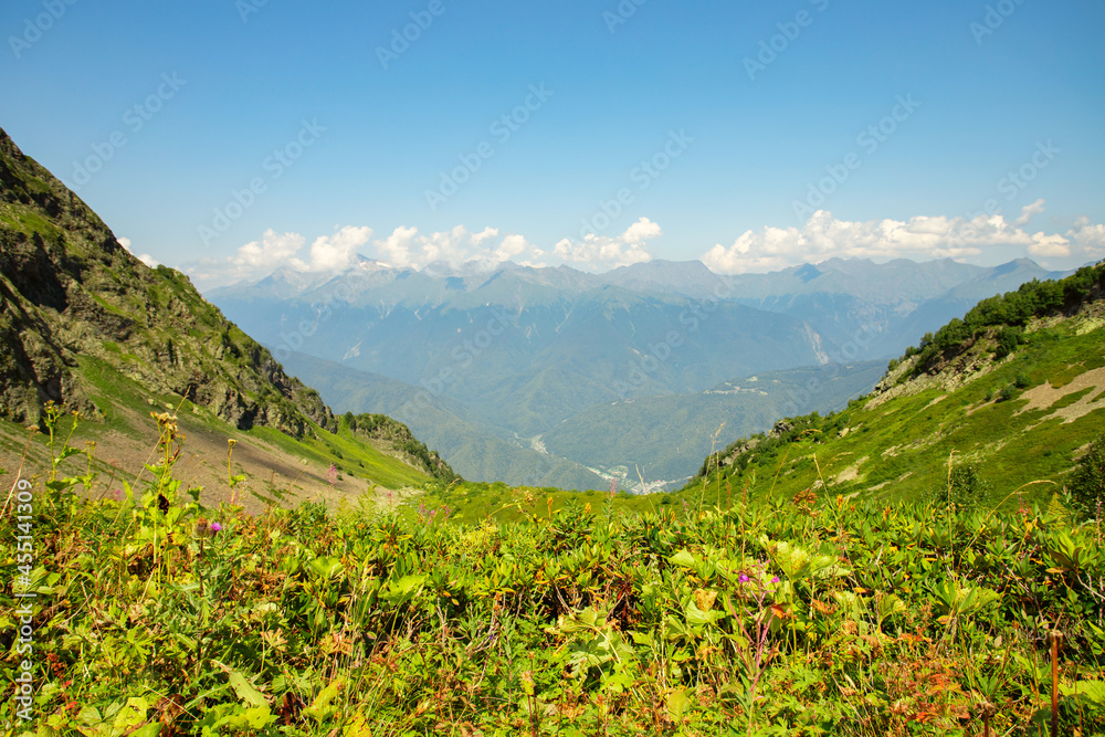 chain of mountains on the landscape on a hike to the alpine peaks and ...
