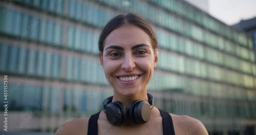Happy young woman satisfied after workout in fitness gym feels ...