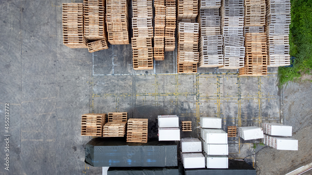 Warehouse with many containers and stockpile in cargo hold. Photo ...