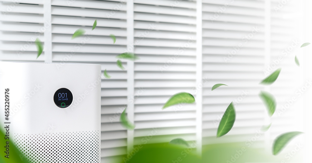 air purifier a living room, air cleaner removing fine dust in house ...