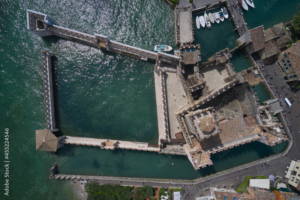 Flag of Italy on the towers of the castle on Lake Garda. Top view of ...