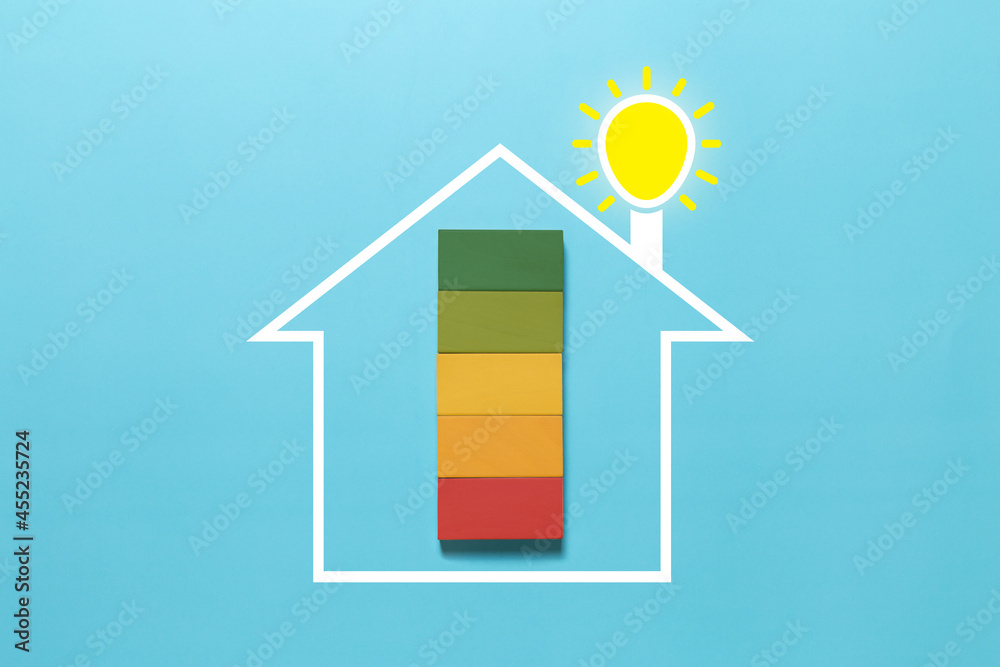 House with full level energy battery green on blue background. Concept ...