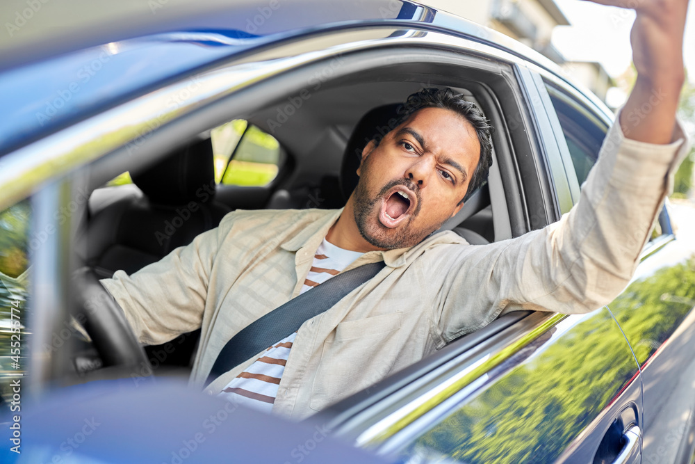 transport, vehicle and people concept - angry indian man or driver ...