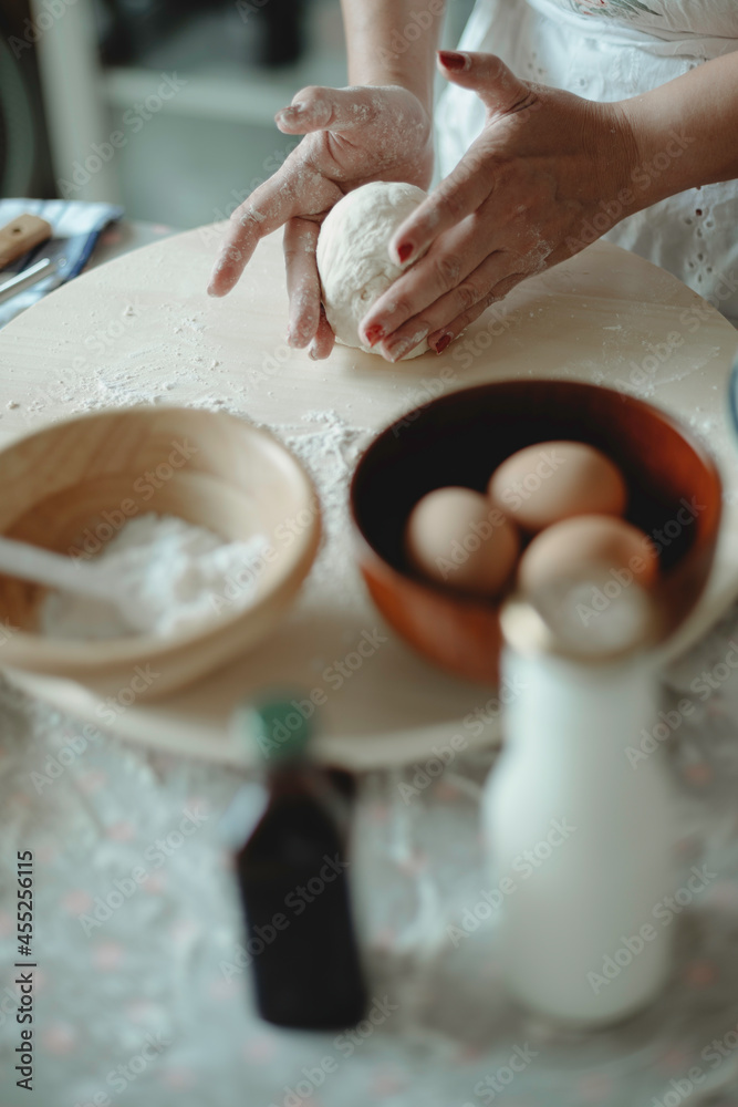 Hand skills in food preparation.Lady molding dough with hands.Messy ...