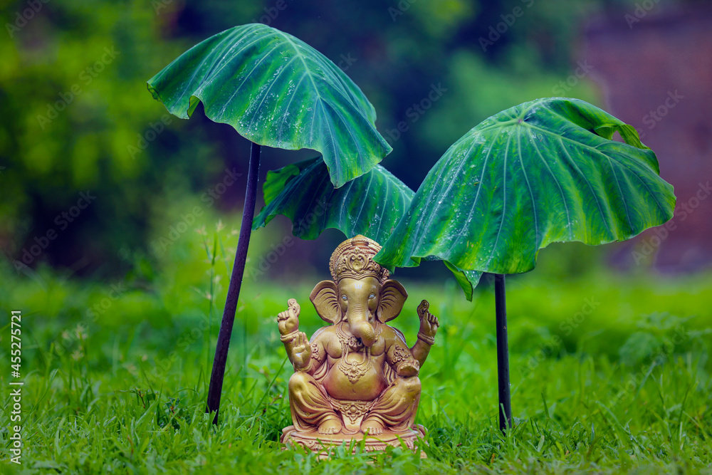 Water splash on lord ganesha sculpture. celebrate lord ganesha festival ...