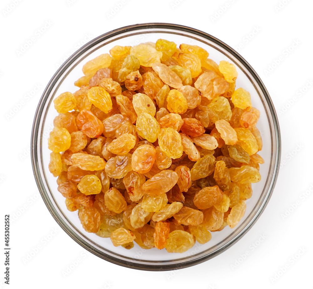 Yellow raisins in a transparent plate on a white background, isolated ...
