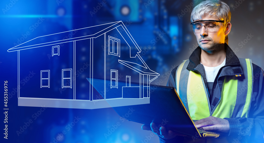 Construction project. Project of a new house. Architect with laptop ...