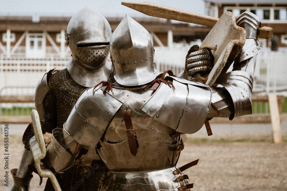 Reenactment of battle with medieval knights in heavy armor on ...