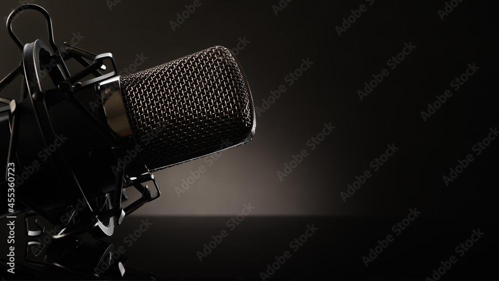 One microphone on a dark gray background. Minimalism. Sing, talk, radio ...