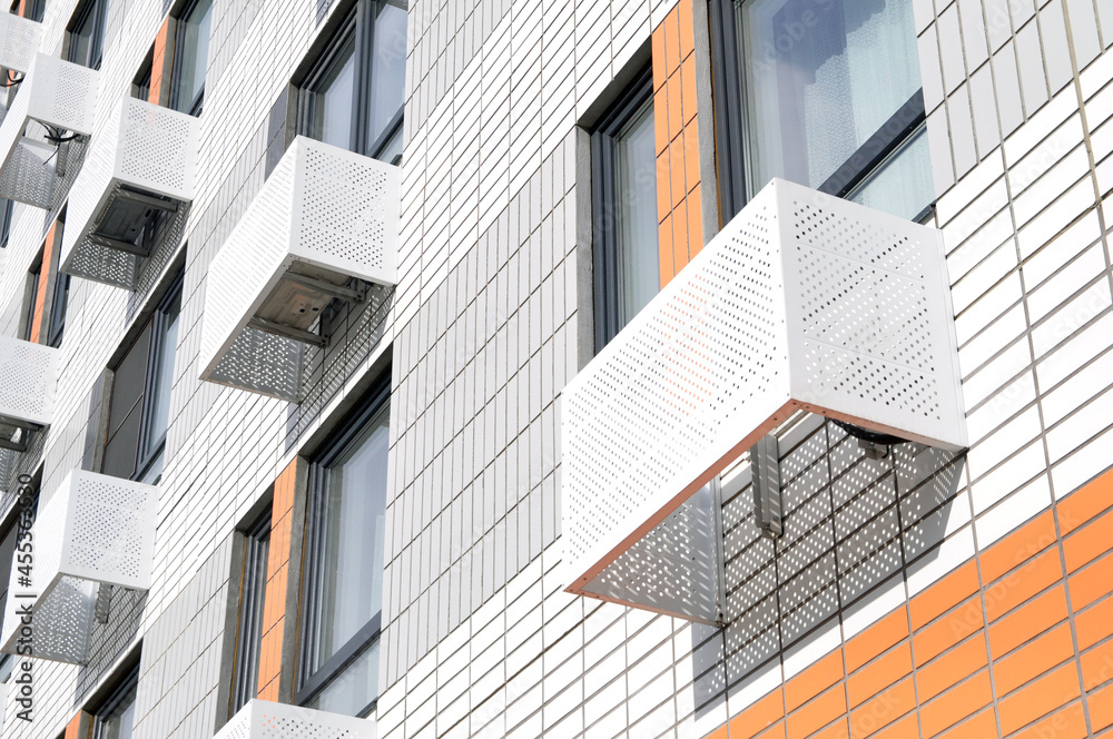 The facade of a new multi-storey residential building with windows and ...